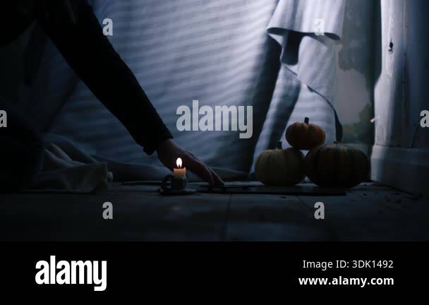 Hand spelling out message on Spirit board wide zoom slow motion shot ...