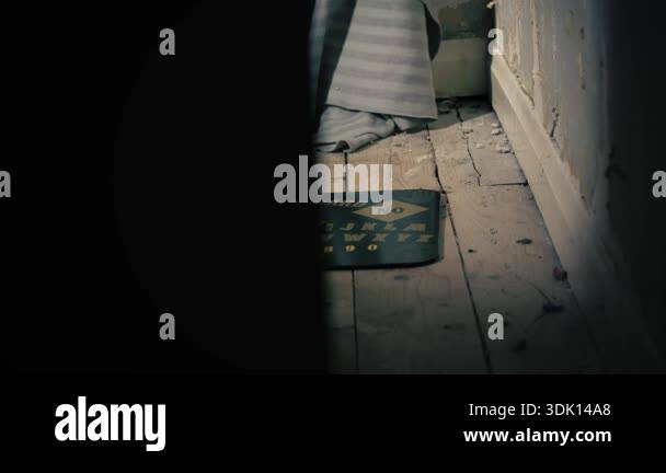 Spirit board in abandoned house through opening door medium 4k slow ...