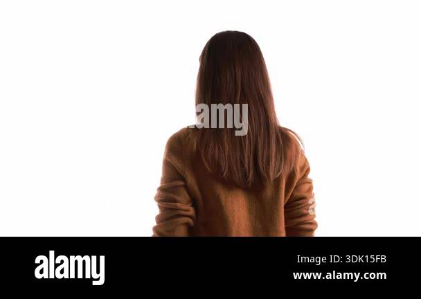 Woman facing camera during 360 rotation on white background. Concept of ...