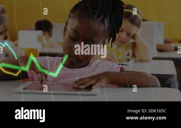 Foreground student tapping tablet screen, revealing graph lines dipping ...