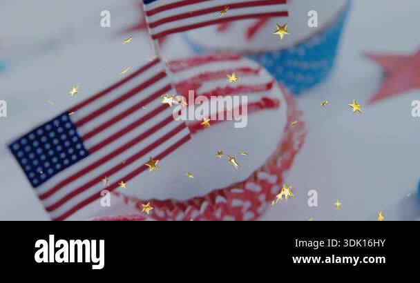 gold confetti drifting over red white blue cupcakes as tilting ...