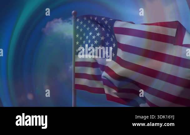 breeze picking up causing American flag rippling and swinging over sky ...