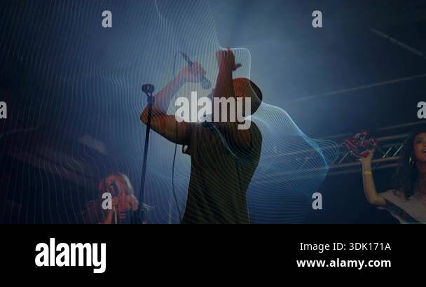 Male vocalist grabbing microphone in live music belting while digital ...