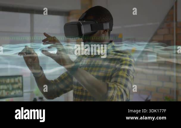 Developer wearing VR headset raising hands and analyzing tech wave data ...