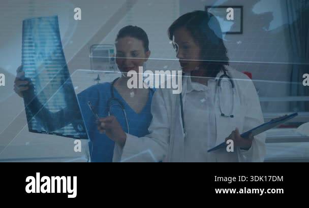 Doctors holding X-ray toward window light and tapping scan details ...