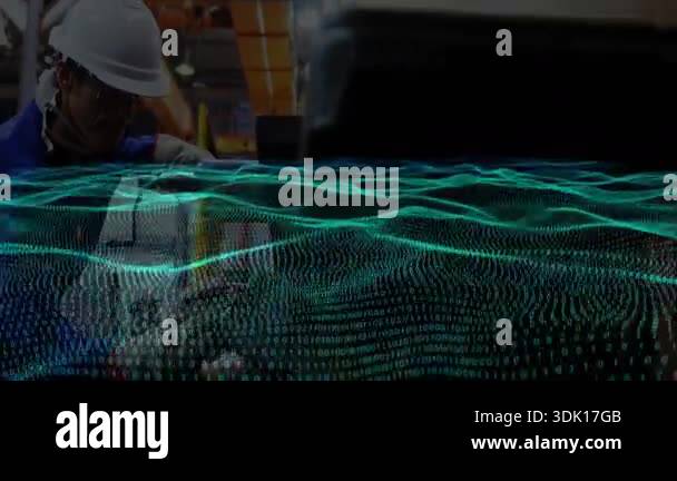 Technician aligning part with milling head initiating machining as ...