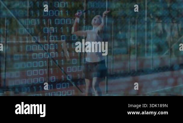 Tennis player tossing ball and swinging racket for serve, preparing ...