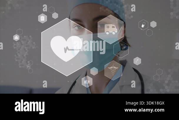 Medical professional in hospital analyzing medical icons fading in ...