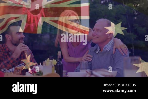 Daughter entering and embracing father while son conversing at table in ...