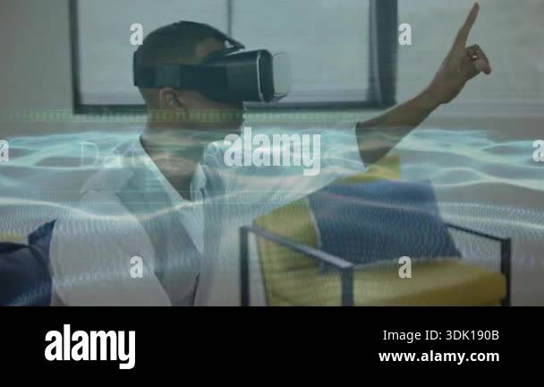 Man wearing VR headset pointing and selecting rotating interface waves ...