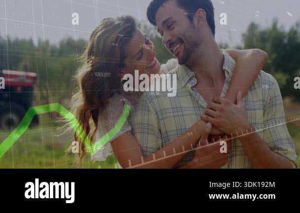 Couple sharing embrace and activating grid with green line graph ...