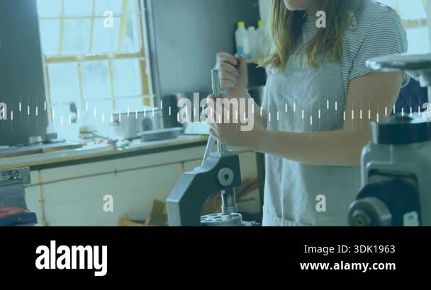 Craftsperson lifting rod under press, pulling lever then inspecting ...