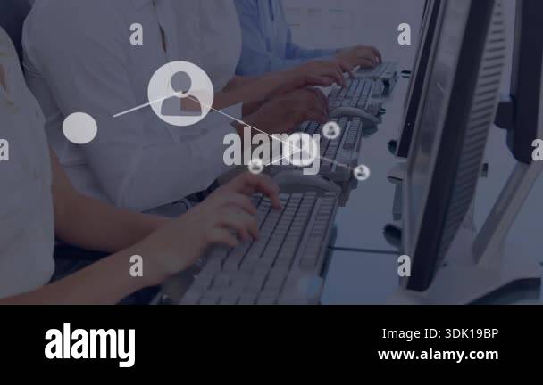 Office workers typing at computers initiating user icons spreading into ...