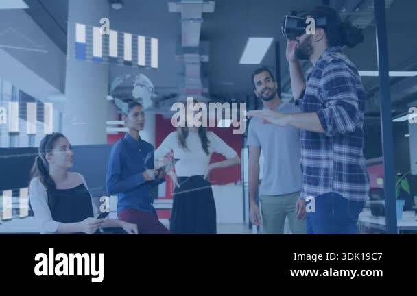 Man wearing VR headset in office raising hand summoning spinning globe ...