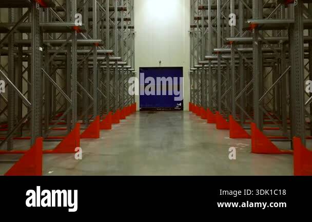 Industrial warehouse empty storage facility with extensive racks. High ...