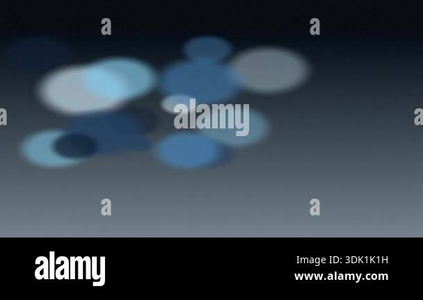 Soft blue bokeh circles create an abstract blurred background suitable ...