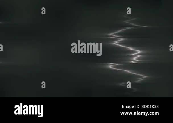 Low light scene of rippling water with silver reflections creating ...