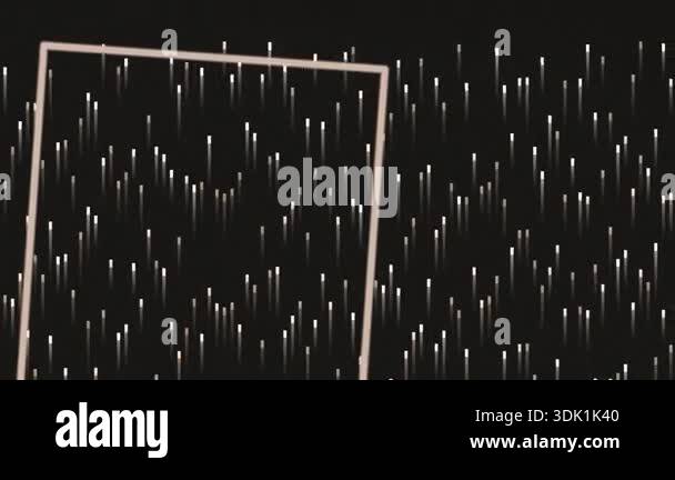 A dark scene shows rain falling behind a rectangular frame creating ...