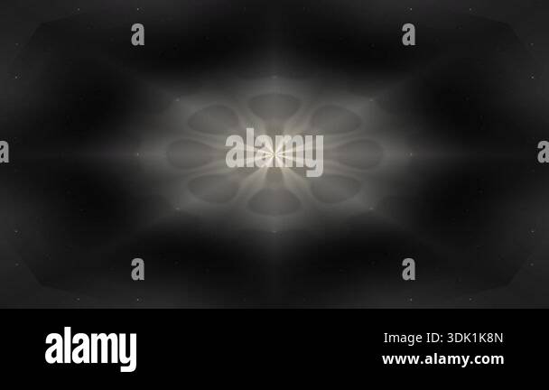 Video loop showing a soft radial light star pattern fading in a dark ...