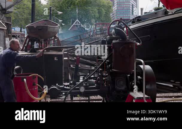 ROTTERDAM, NETHERLANDS - SEPTEMBER 13, 2025 - Man operating vintage ...