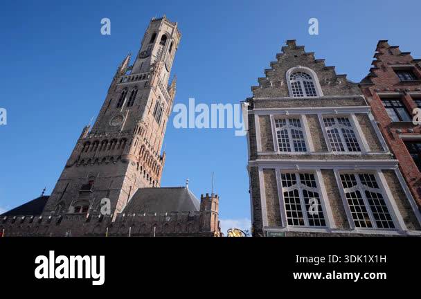 Medieval Bruges Belfry tower and Flemish gabled buildings against ...