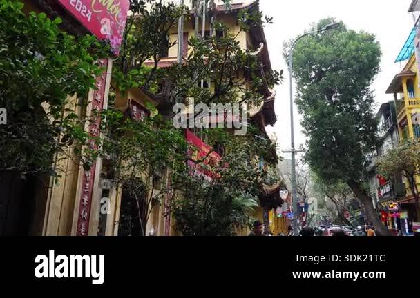 People walking on a busy, vibrant street Stock Video Footage - Alamy