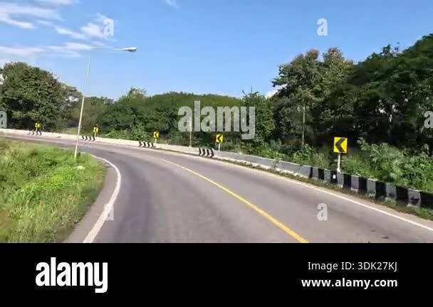 Group of cyclists navigating a winding road Stock Video Footage - Alamy