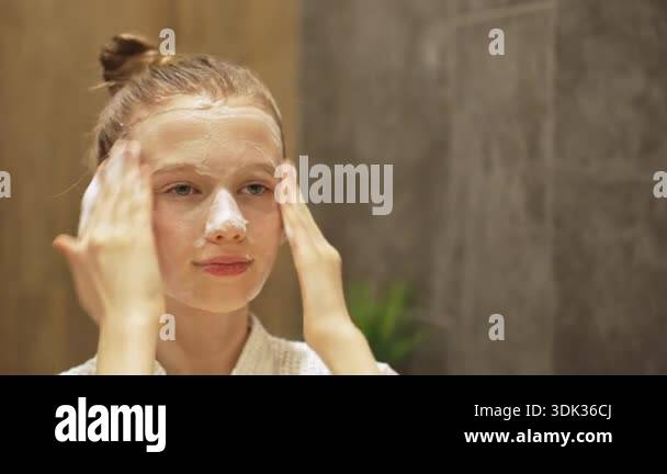 Smiling Teen Girl gently Applies Cleansing Foam, Facial Cleanser to ...
