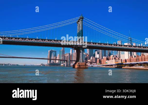 Massive Manhattan Bridge tower looms over the East River and the ...