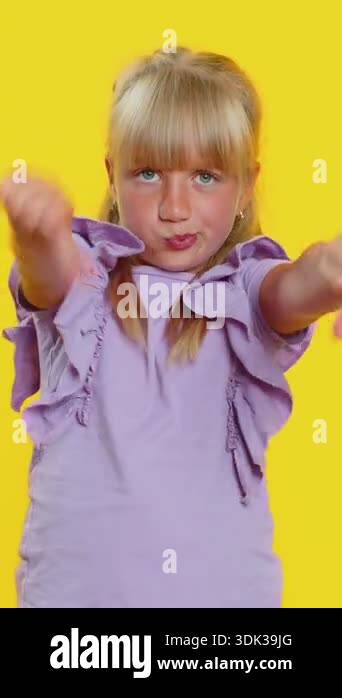 Dislike. Upset young preteen child lady kid showing thumbs down sign ...