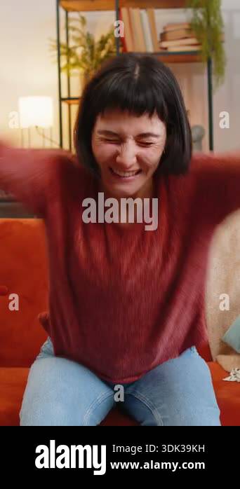 Portrait of happy Caucasian woman shouting, celebrating success ...