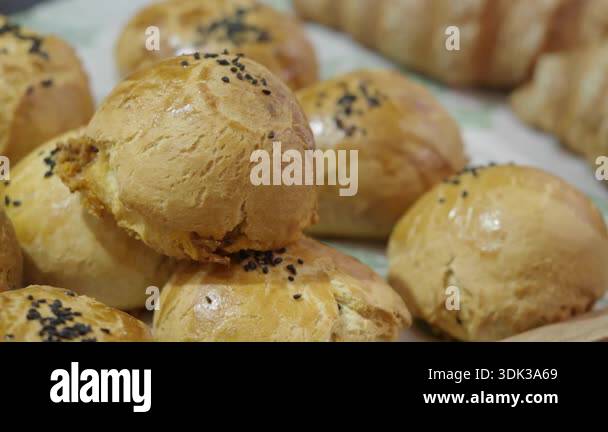 People gather to enjoy fresh bread rolls at the bakery Stock Video ...