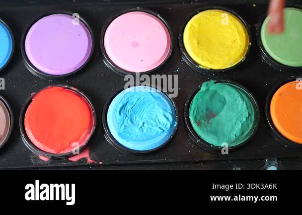 Different colors from a paint set spread on the table for art Stock ...