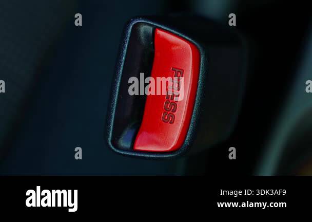 The word LIFE is glued to the seat belt buckle in a car, close-up. High ...