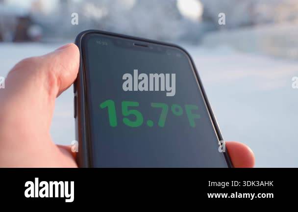 Thermometer on smartphone shows low temperature drop in Fahrenheit ...