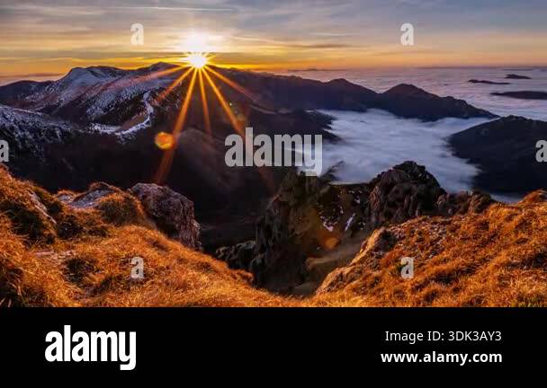 Beautiful sunset in early spring alpine mountains with last snow ...