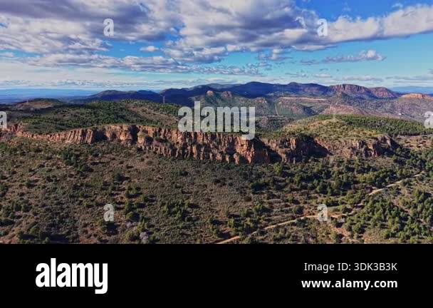 High view of rocky hills and green trees in Spain. The scene shows ...