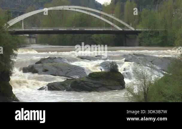 Fast and turbulent river flow after heavy rainfall. A powerful surge of ...