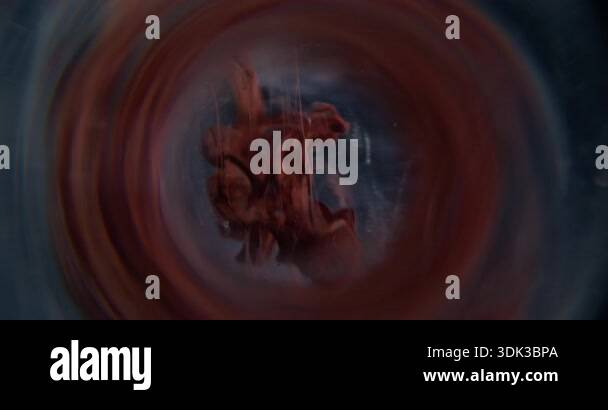 Defocused fume drop. Dye swirl. Brown steam liquid paint dissolving in ...