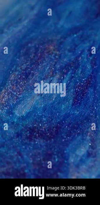 Vertical video. Glitter paint blend. Sparkling marble. Defocused blue ...