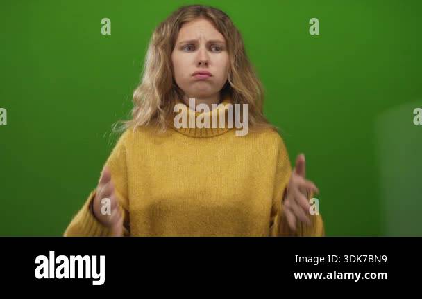 Woman hand fanning in a studio easing heat while blonde young subject ...
