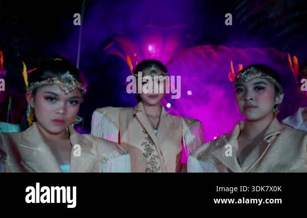 Three female performers looking fiercely at the camera, showcasing ...