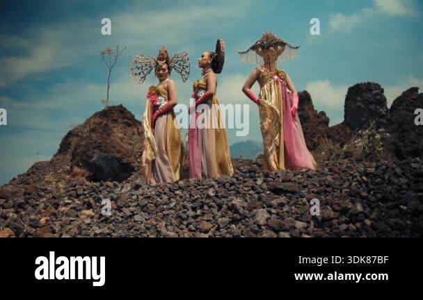 Full-length shot of three female models showcasing creative gold ...