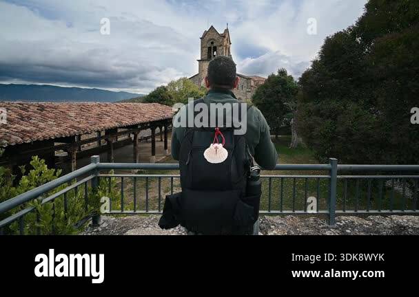 Male pilgrim on the Camino de Santiago taking a picture with his ...