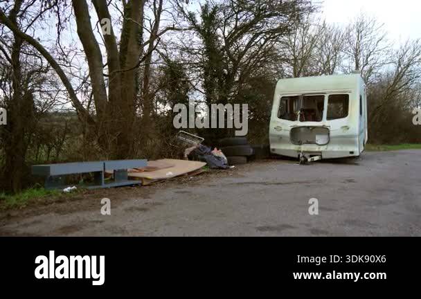 Abandoned caravan deteriorating along roadside creating unsafe living ...
