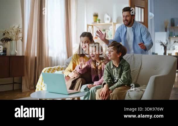 Mom kids greeting videocall sitting apartment couch. Joyful father ...