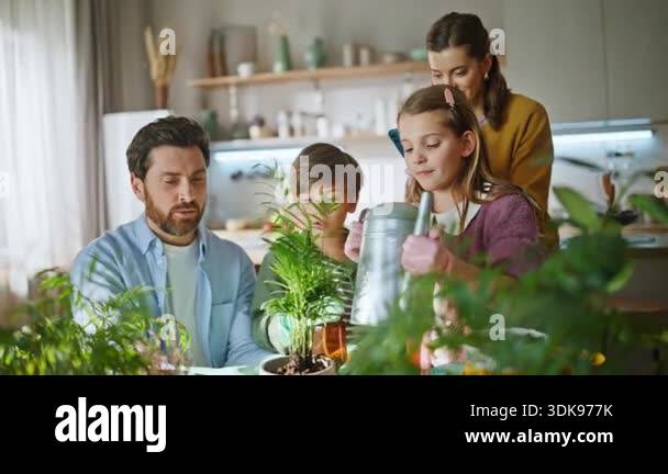 Mother filming family gardening with smartphone apartment kitchen ...