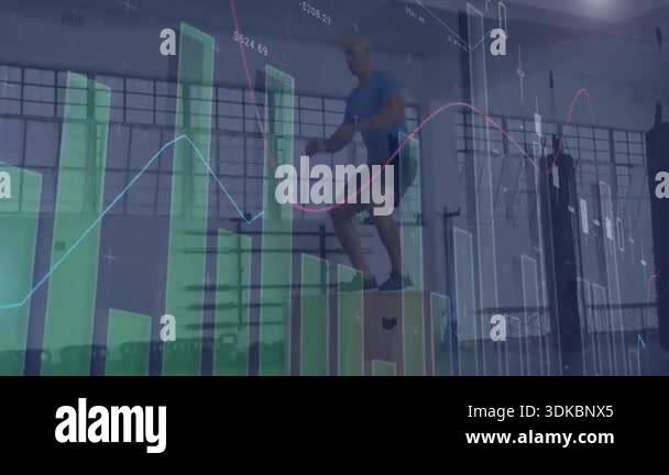 Fitness trainer lowering into squat, jumping onto gym box, syncing ...