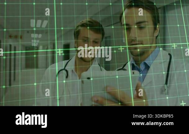 Two male doctors walking hospital hall, pulling tablet and displaying ...