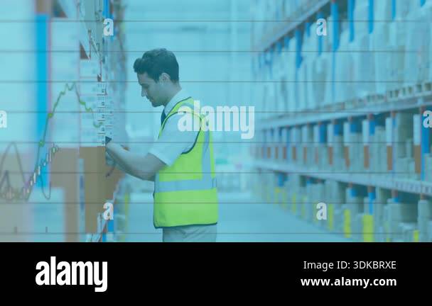 Warehouse worker entering aisle, lifting box and scanning barcode for ...